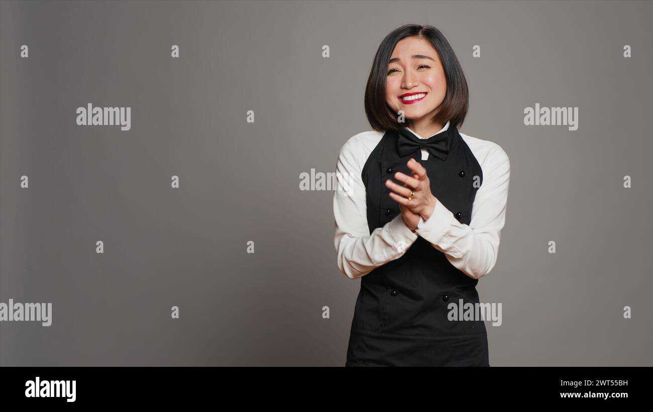 Asian server applauding someone and cheering for success, saying ...