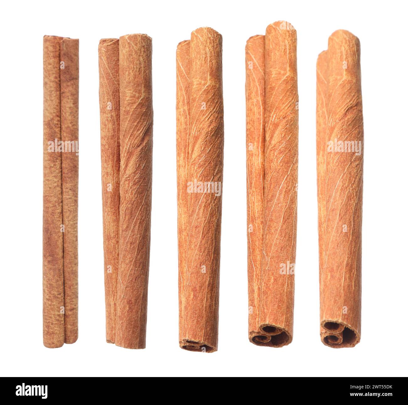 Aromatic dry cinnamon sticks isolated on white, set Stock Photo - Alamy