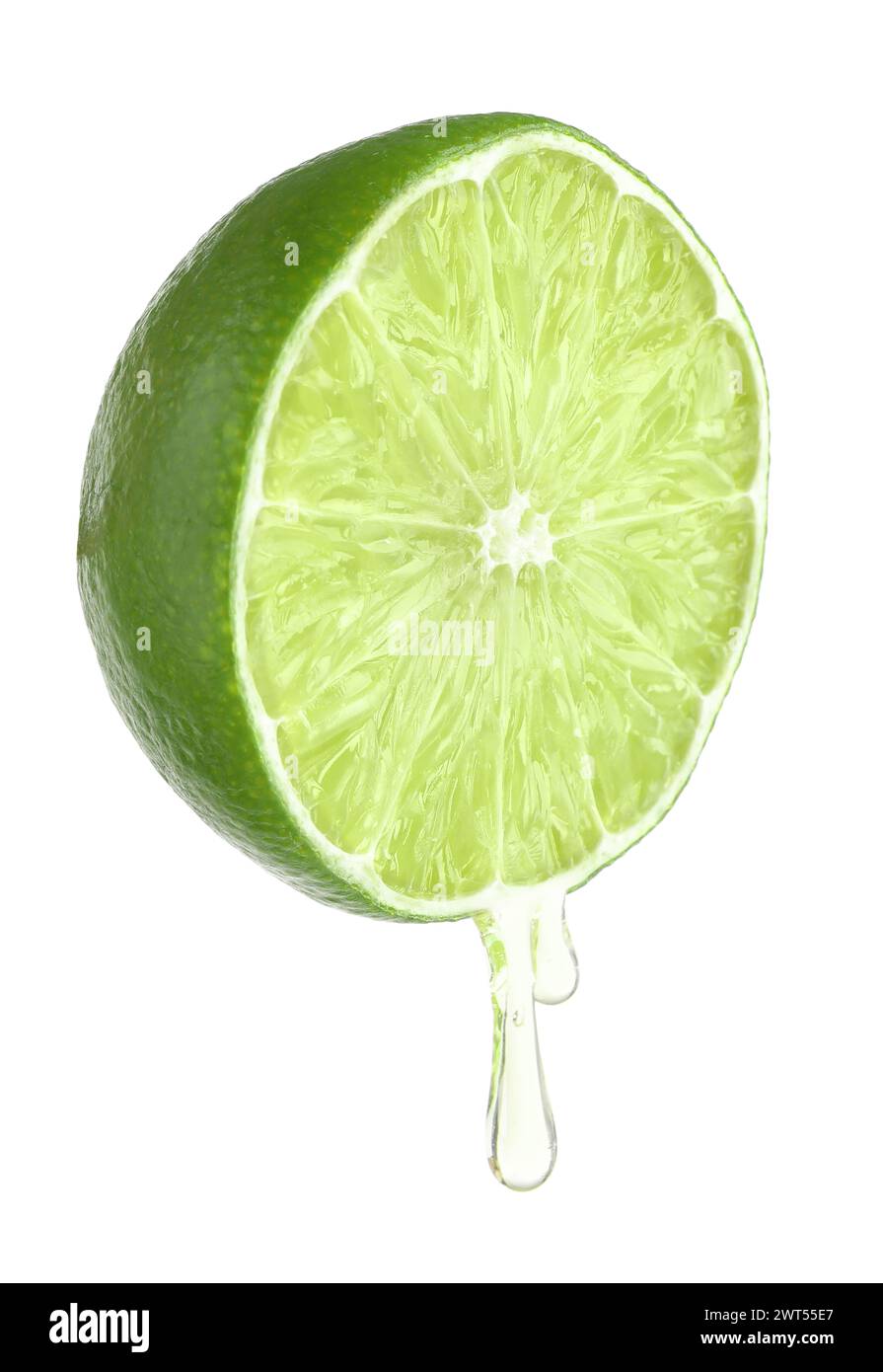 Lime juice dripping from fruit on white background Stock Photo - Alamy