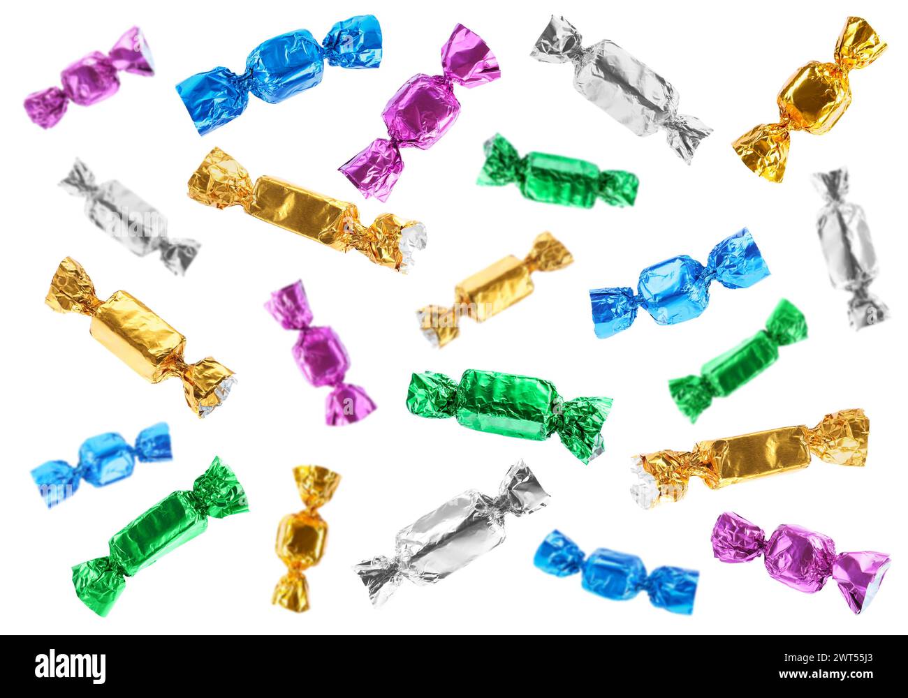 Tasty candies in bright wrappers falling on white background Stock ...
