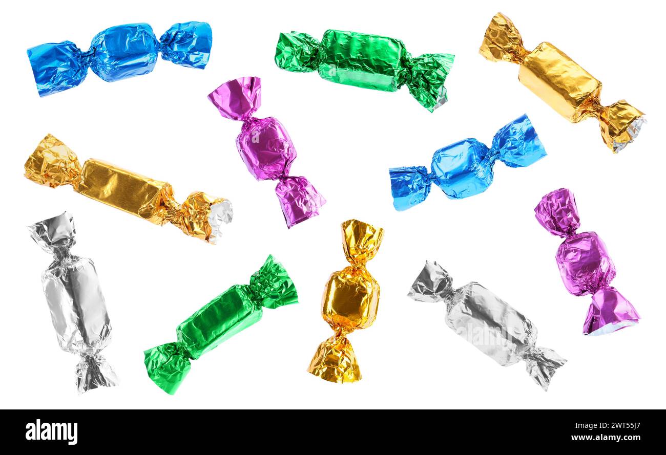 Tasty candies in bright wrappers falling on white background Stock ...