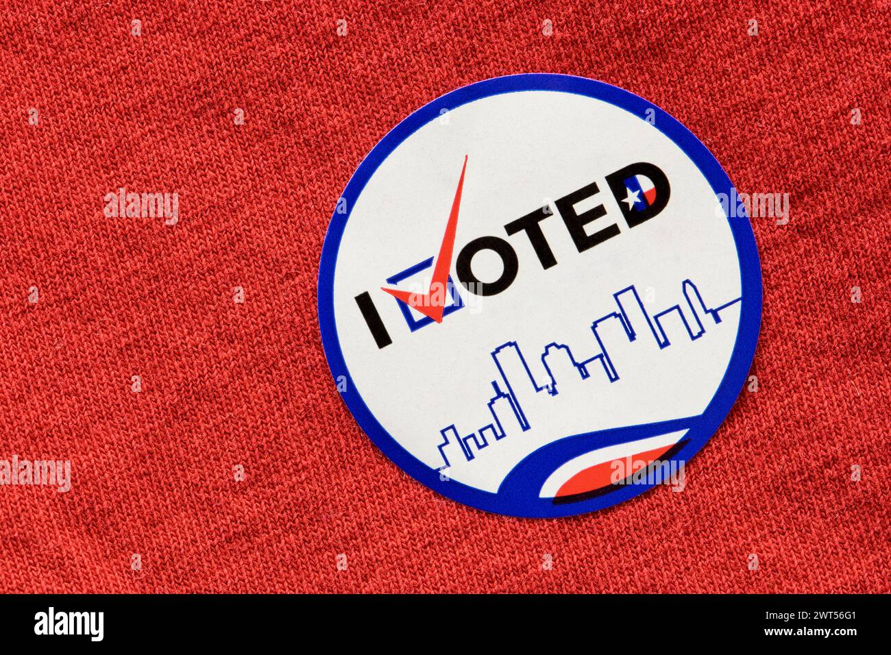 I Voted sticker on a red shirt indicating Republican party. Isolated ...