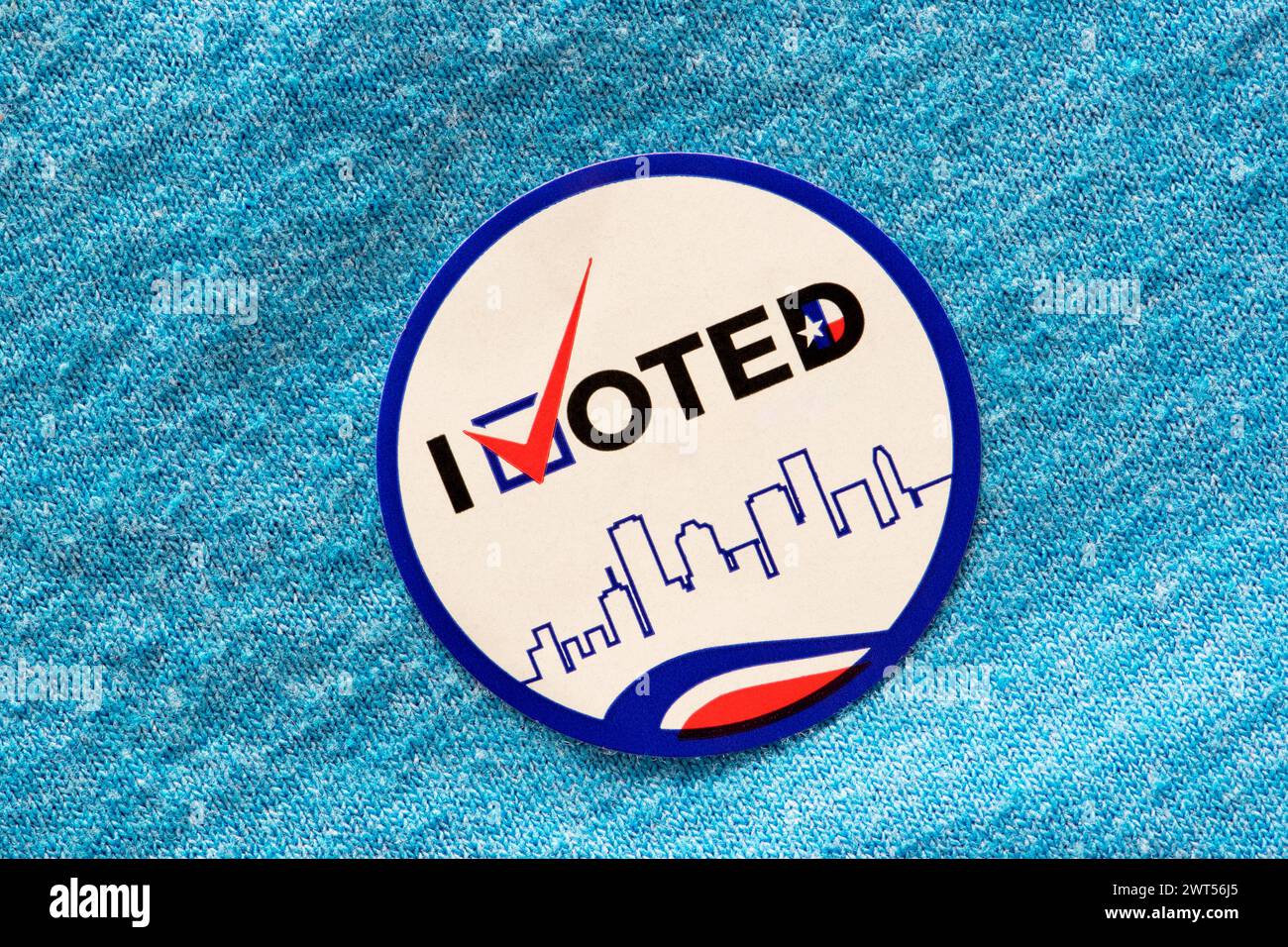 I Voted sticker on a blue shirt indicating Democrat party. Isolated ...