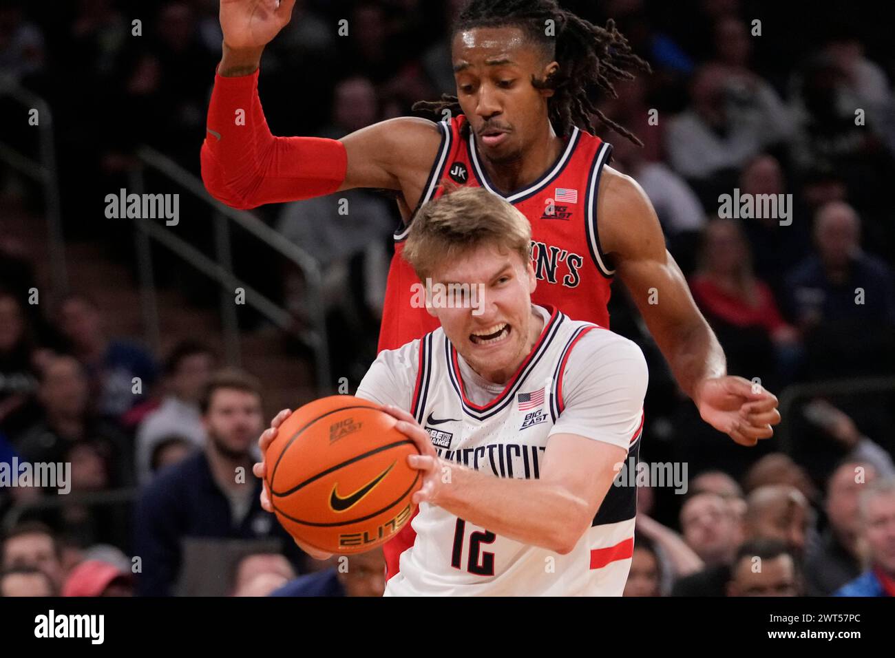UConn guard Cam Spencer (12) drives against St. John's guard Daniss ...