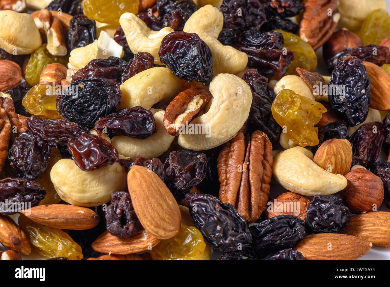 mixture of nuts and dried fruits complemented by vitamins and trace ...