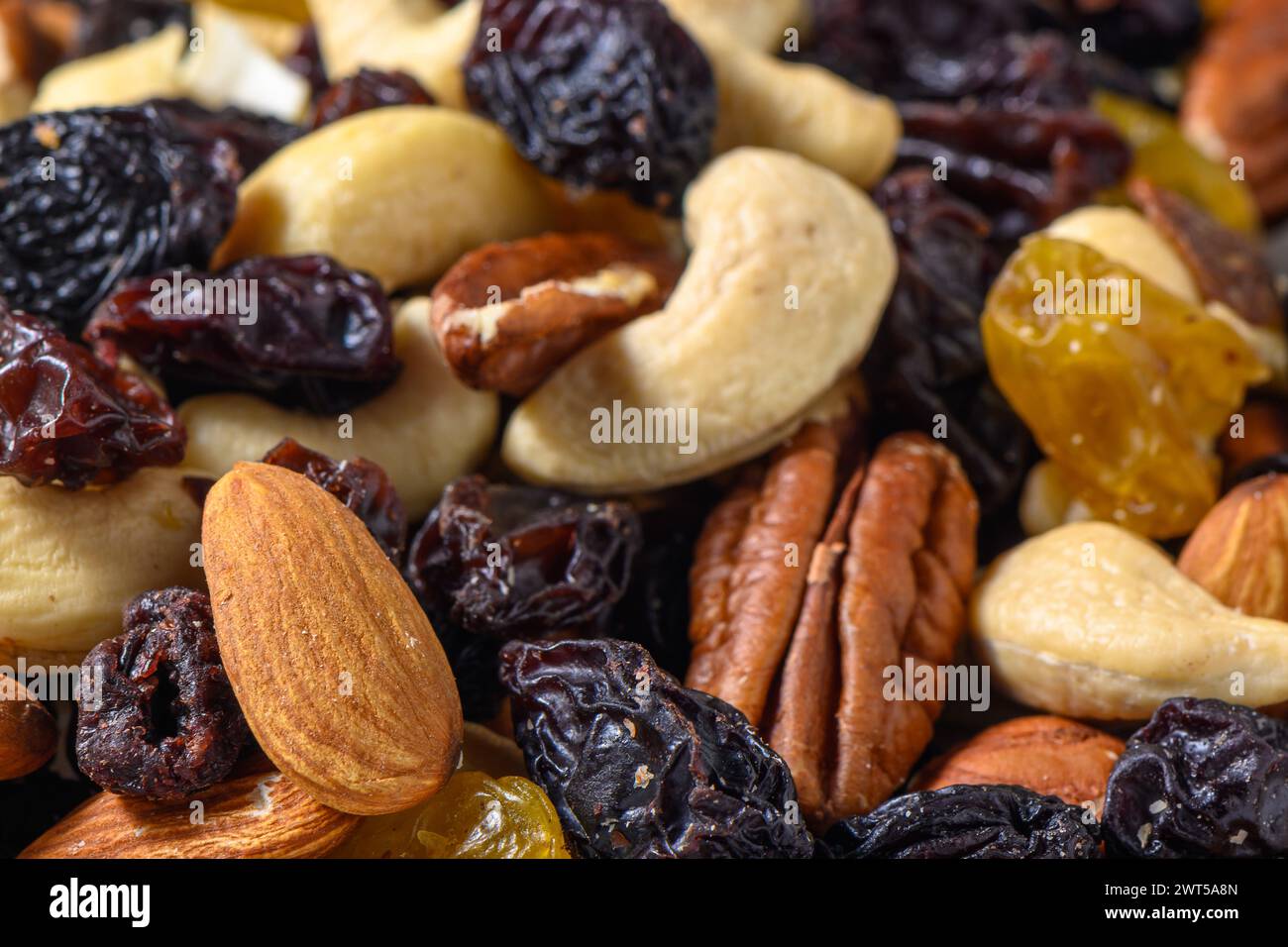 mixture of nuts and dried fruits complemented by vitamins and trace ...