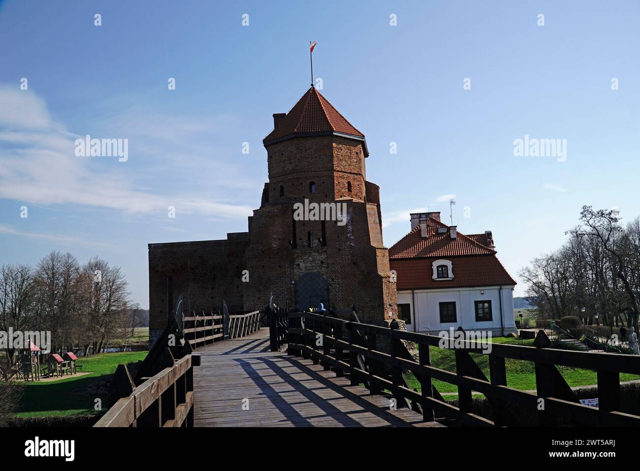 Liw, Poland - March 10th, 2024 - Gothic medieval castle and wooden ...