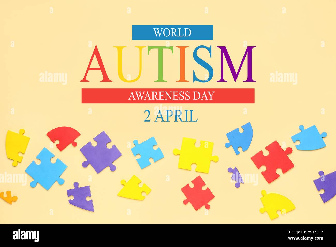 Jigsaw puzzle pieces and text WORLD AUTISM AWARENESS DAY on beige ...