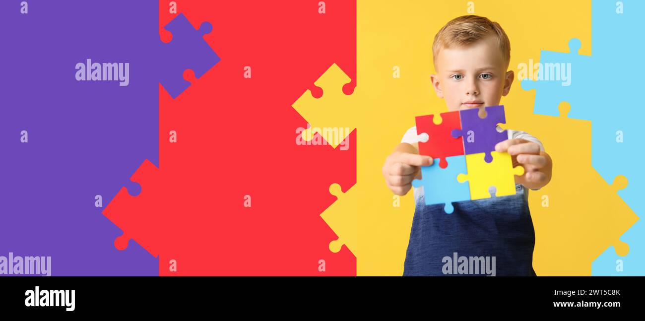 Little boy with autistic disorder holding jigsaw puzzle pieces on color ...