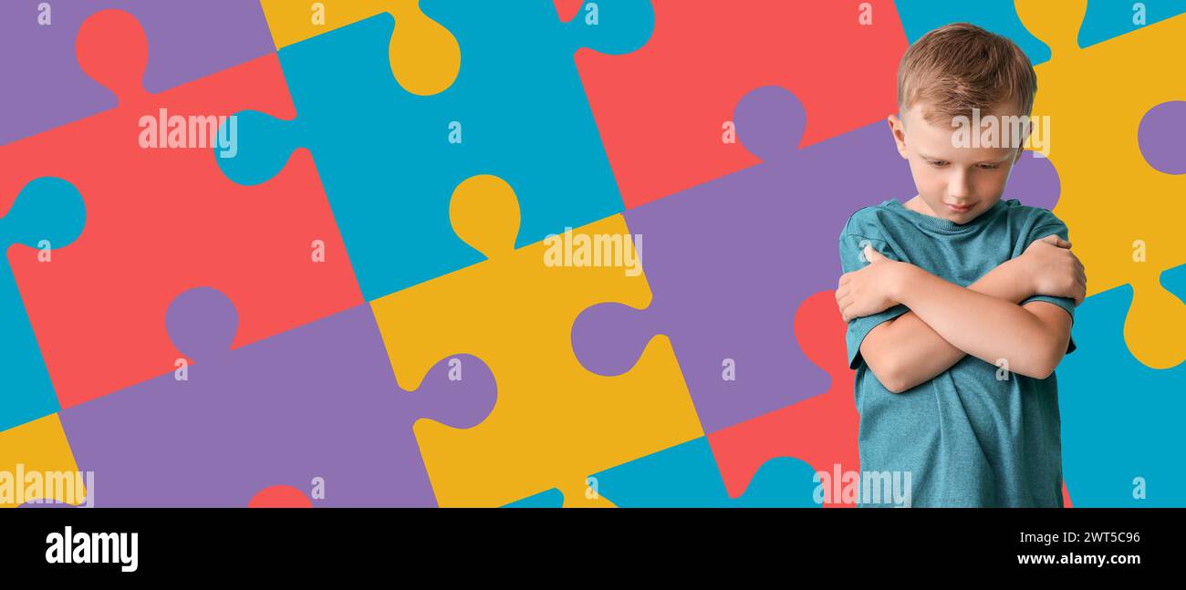 Sad little boy with autistic disorder on color background with space ...