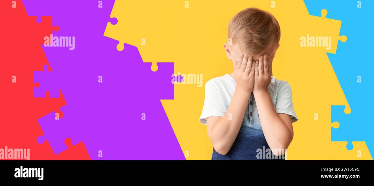 Sad little boy with autistic disorder on color background with space ...