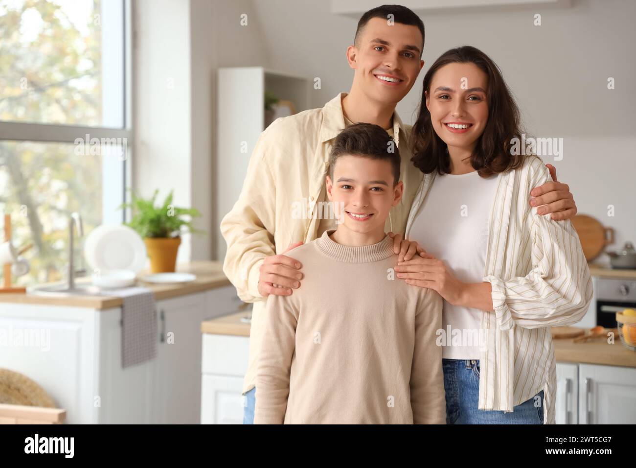 Little boy with his parents at home Stock Photo - Alamy
