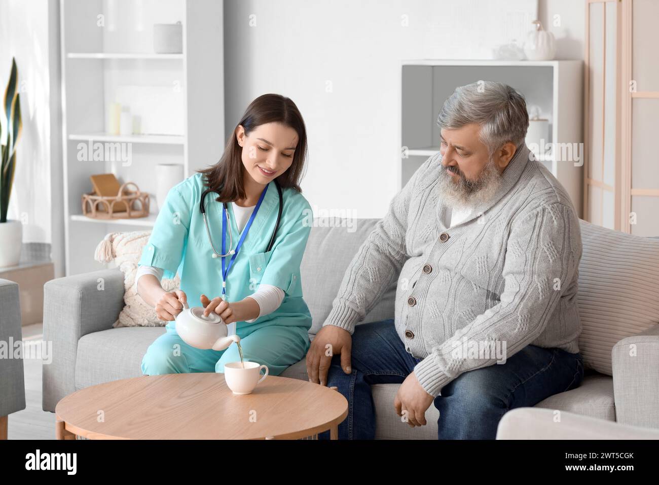 Doctor sitting table drinking tea hi-res stock photography and images ...