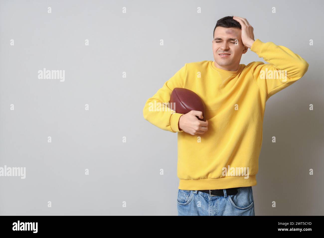 Rugby player with brain concussion on light background Stock Photo - Alamy