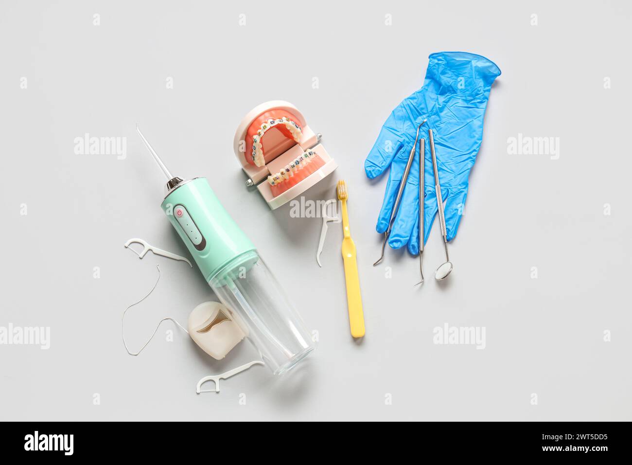 Set for oral hygiene with oral irrigator and dentist's tools on light ...