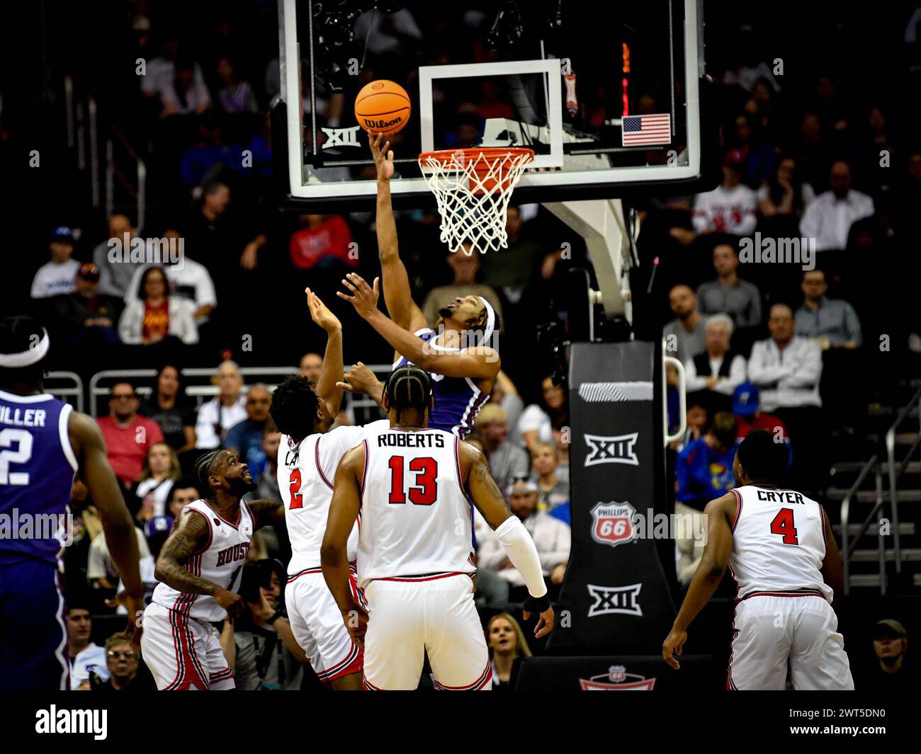 Kansas City, Missouri, USA. 14th Mar, 2024. TCU (12) Xavier Cork lays ...