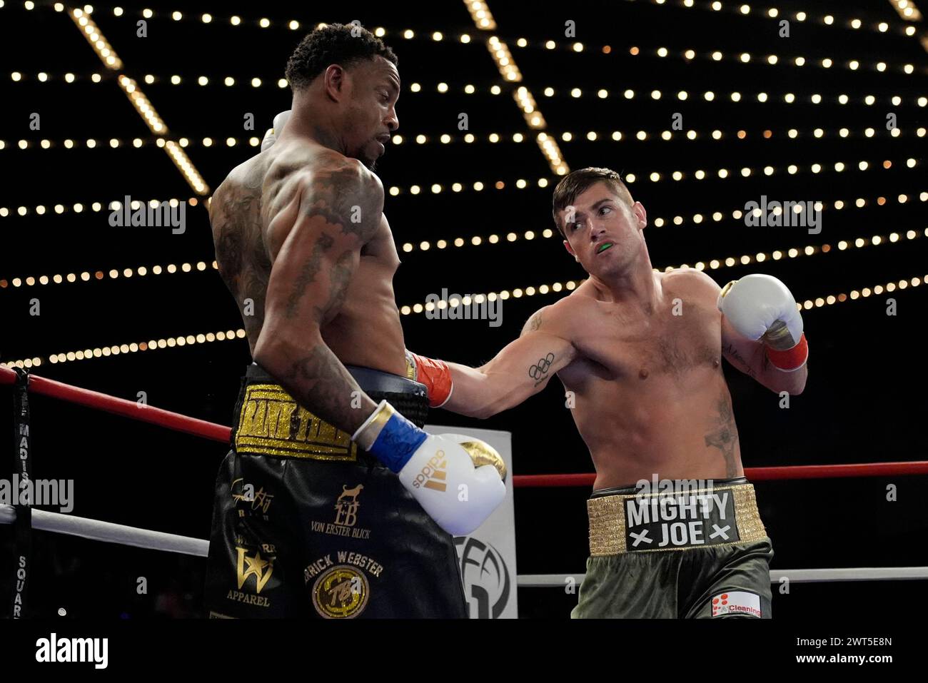 Ireland's Joseph Ward, right, punches Derrick Webster, left, during the first round of a light ...
