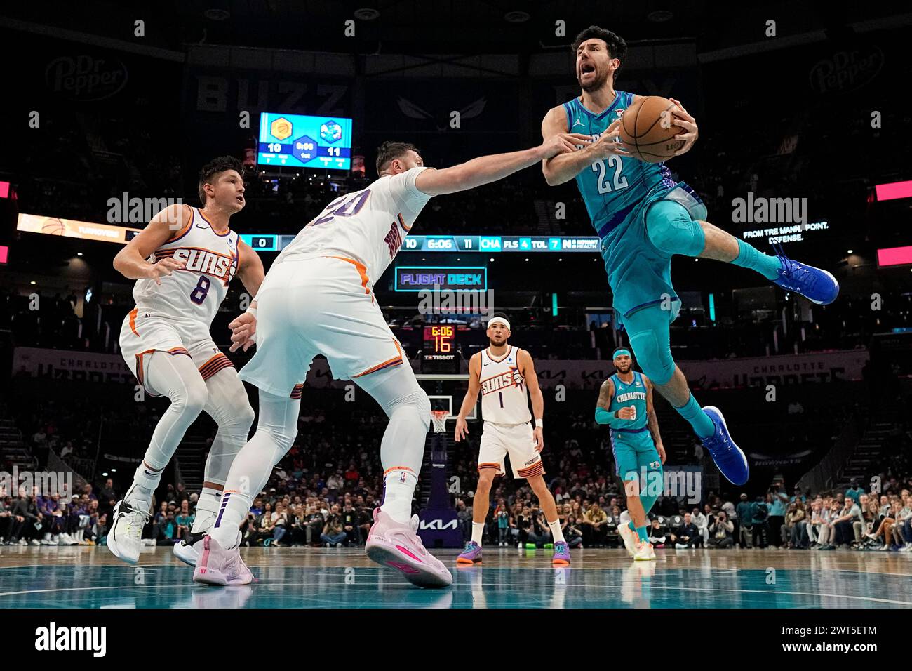 Charlotte Hornets guard Vasa Micic, is fouled by Phoenix Suns center ...