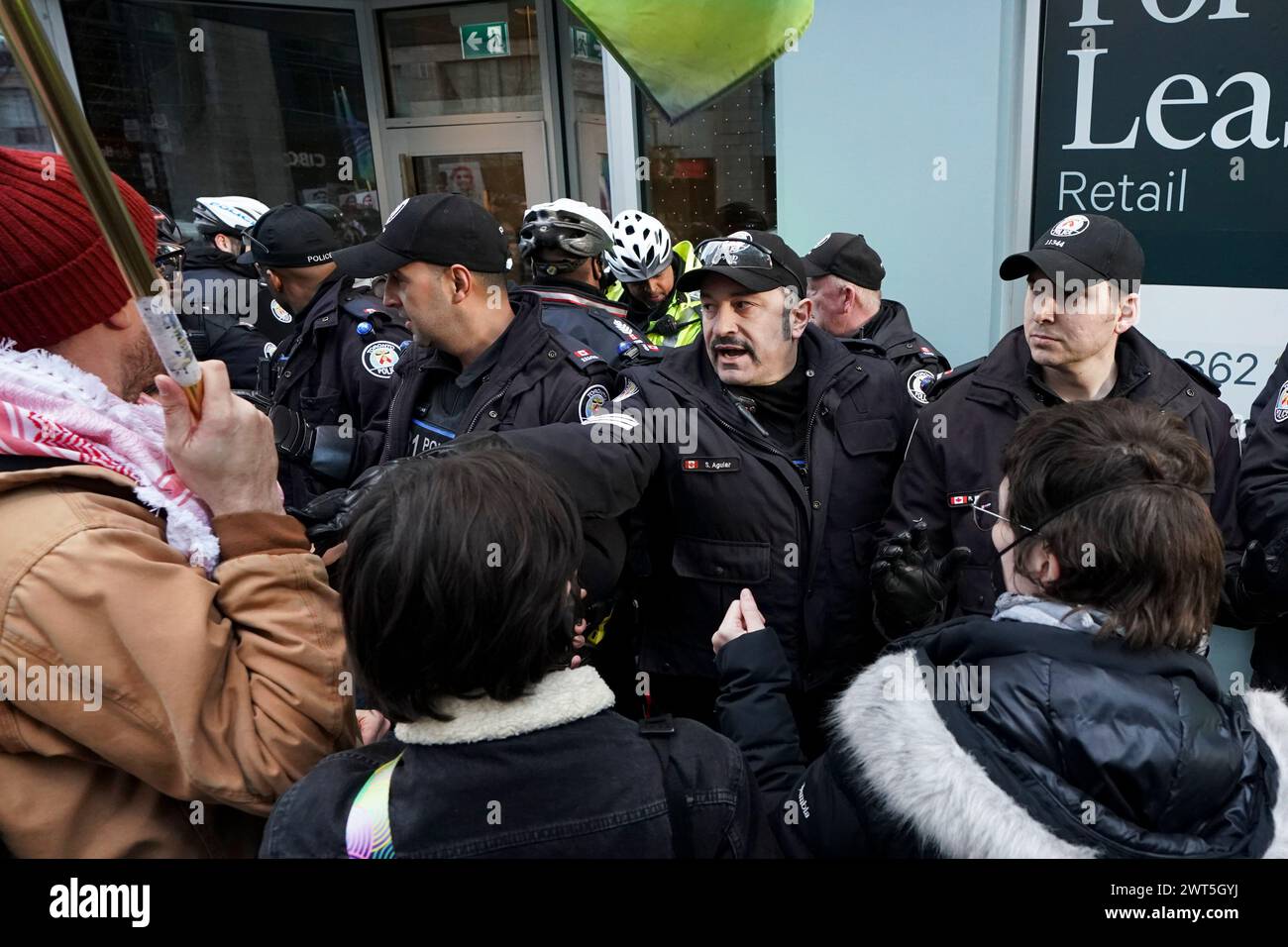 Toronto, Canada. 15th Mar, 2024. Police clash with protesters outside a ...