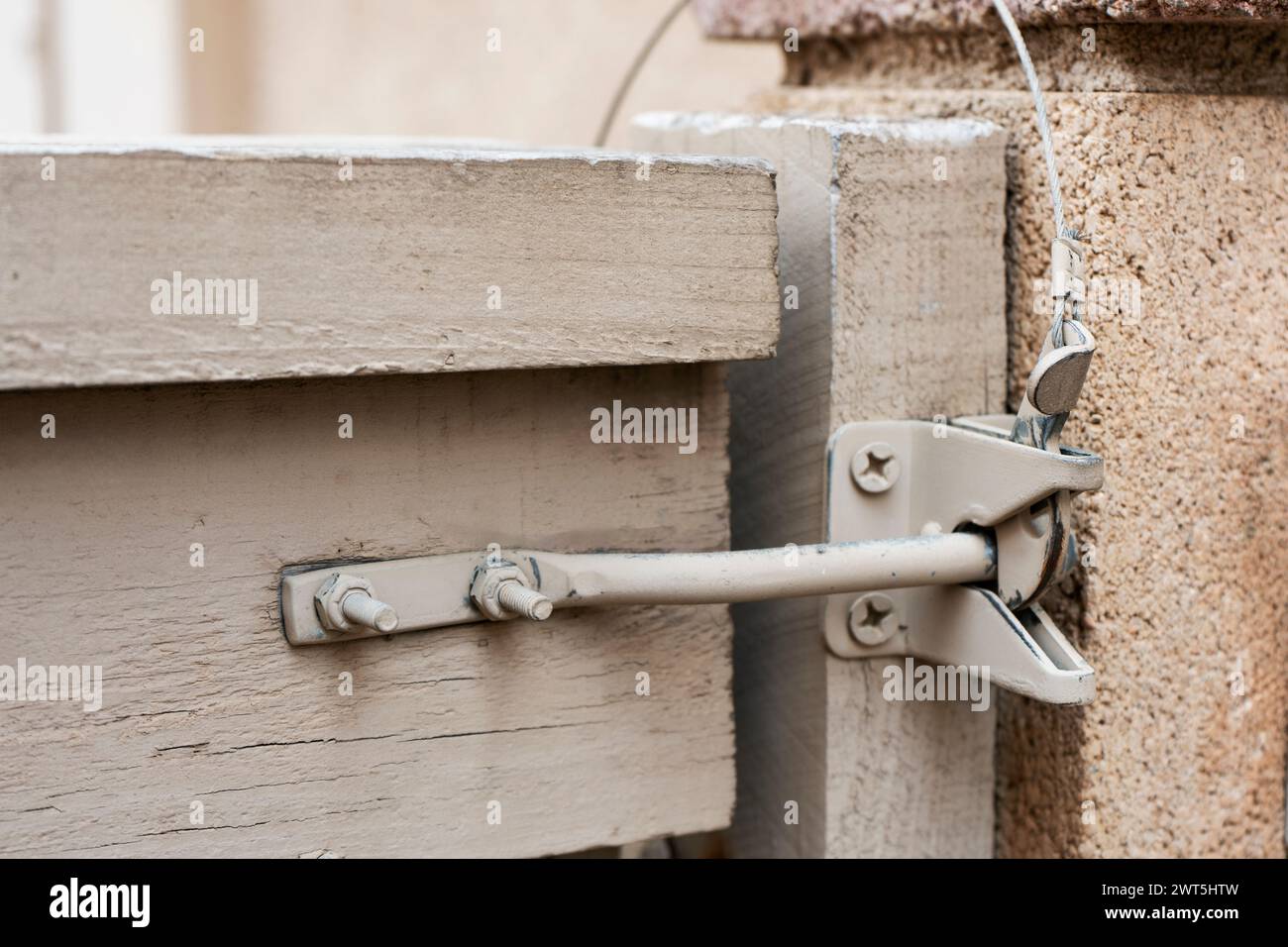 Latch on gate. A design for locking of gate from within Stock Photo - Alamy