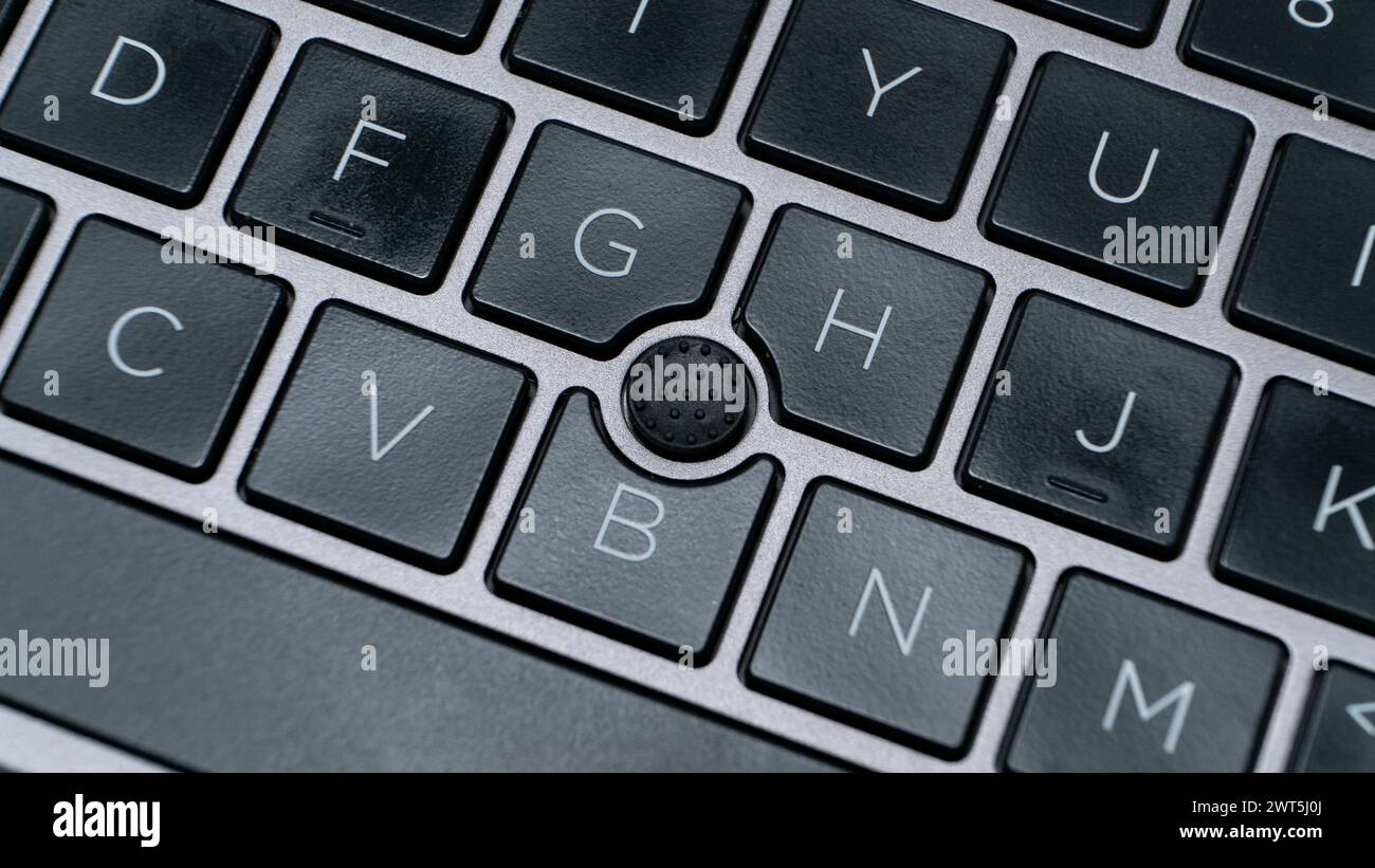 laptop keyboard with focus on pointing stick track point Stock Photo ...