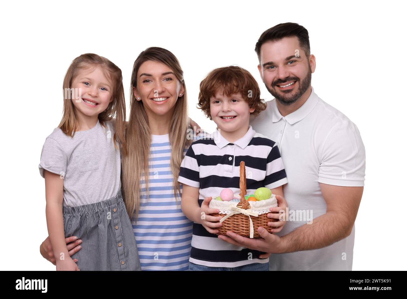 Easter celebration. Happy family with wicker basket full of painted ...
