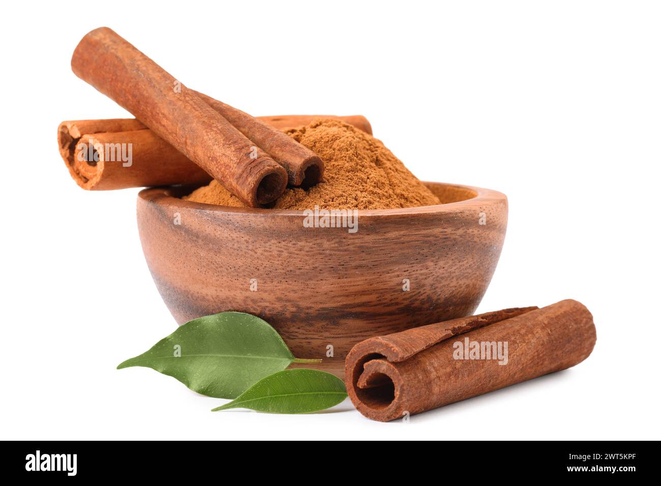 Dry aromatic cinnamon sticks, powder and green leaves isolated on white ...