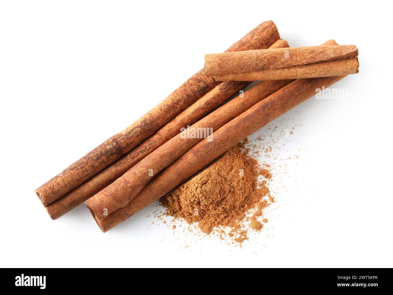 Dry aromatic cinnamon sticks and powder isolated on white, top view ...