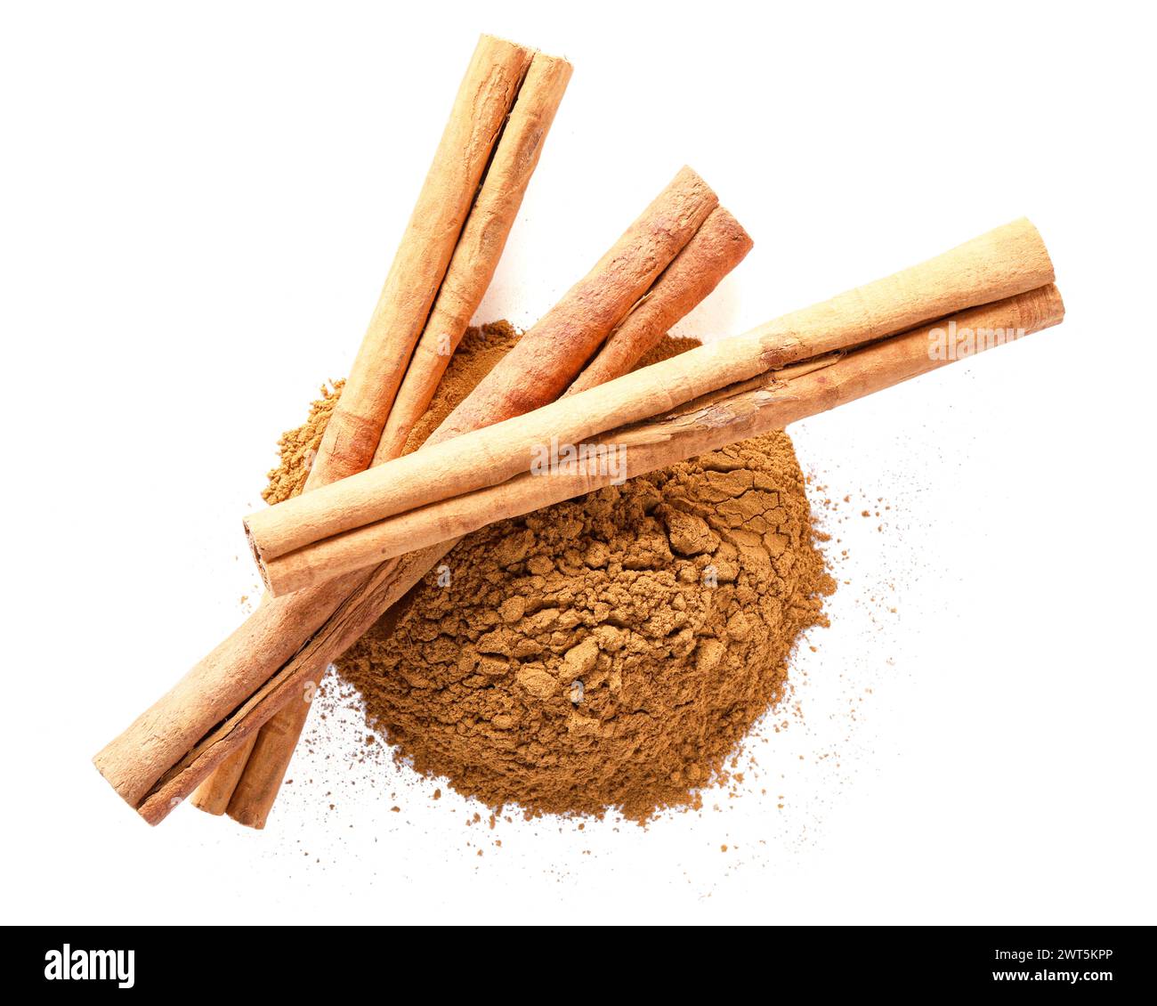 Dry aromatic cinnamon sticks and powder isolated on white, top view ...