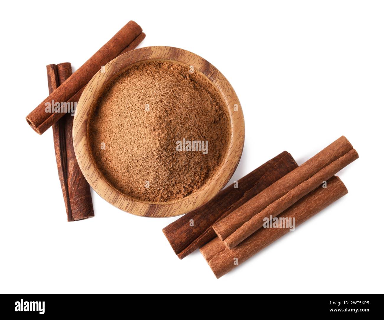 Dry aromatic cinnamon sticks and powder isolated on white, top view ...