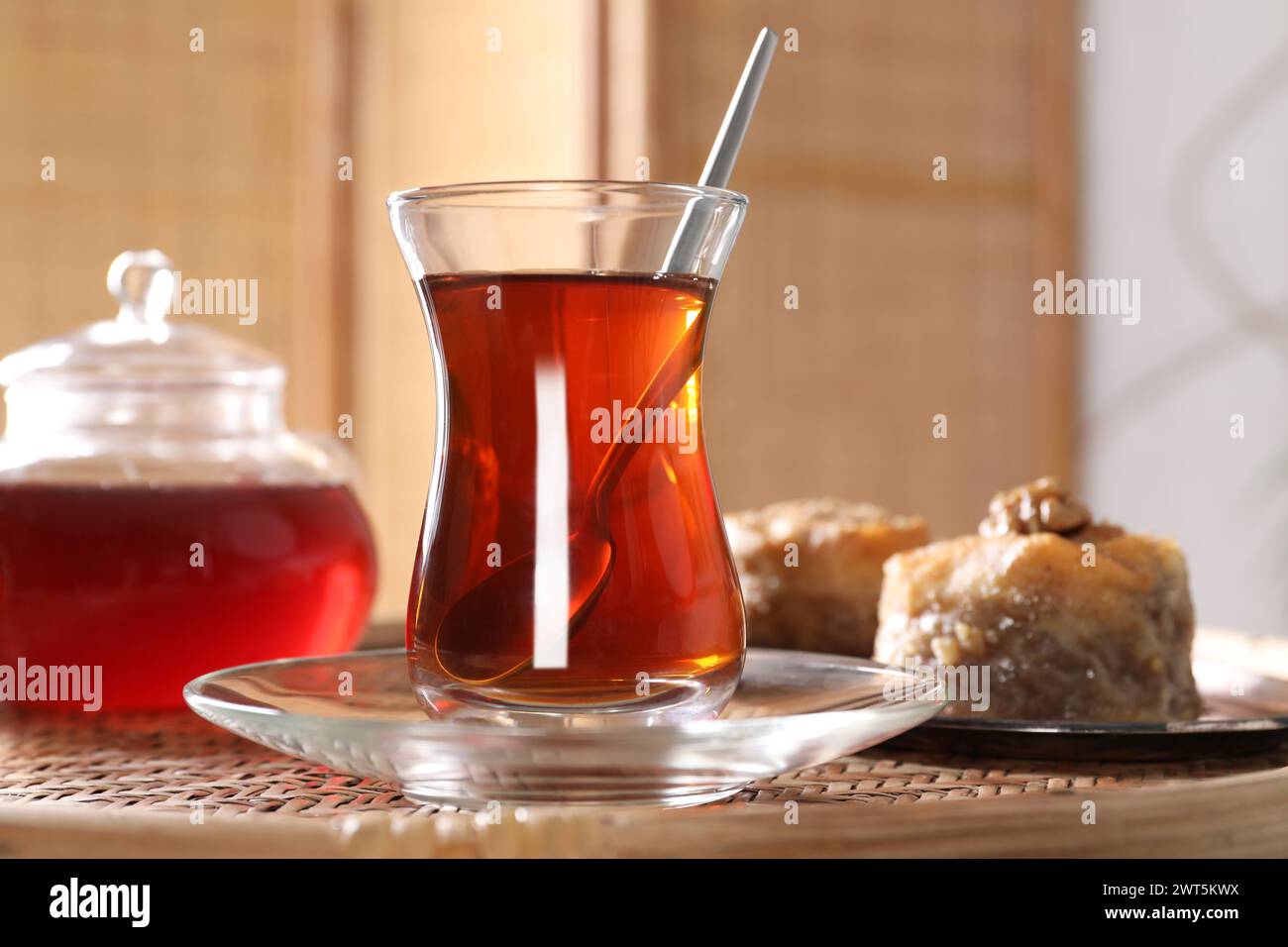 Traditional Turkish tea in glass on wicker table, closeup Stock Photo ...