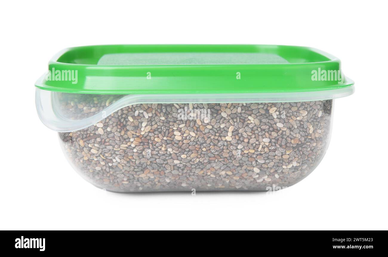 Plastic container filled with chia seeds isolated on white Stock Photo ...