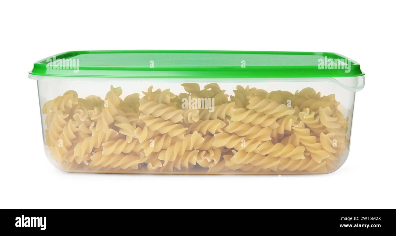 Plastic container filled with pasta isolated on white Stock Photo - Alamy