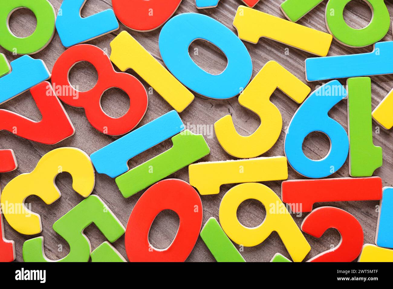 Colorful numbers on wooden school desk, top view Stock Photo - Alamy