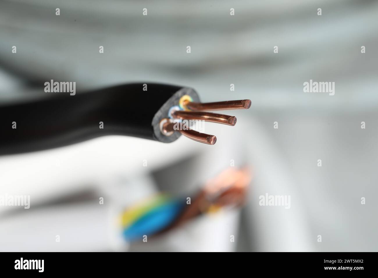 Black electrical wire on blurred background, closeup Stock Photo - Alamy