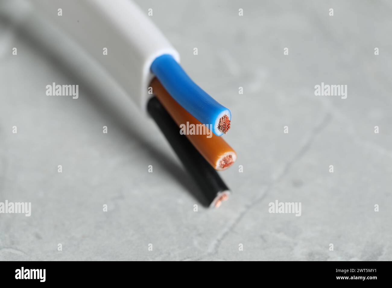 Colorful electrical wire on gray surface, closeup Stock Photo - Alamy