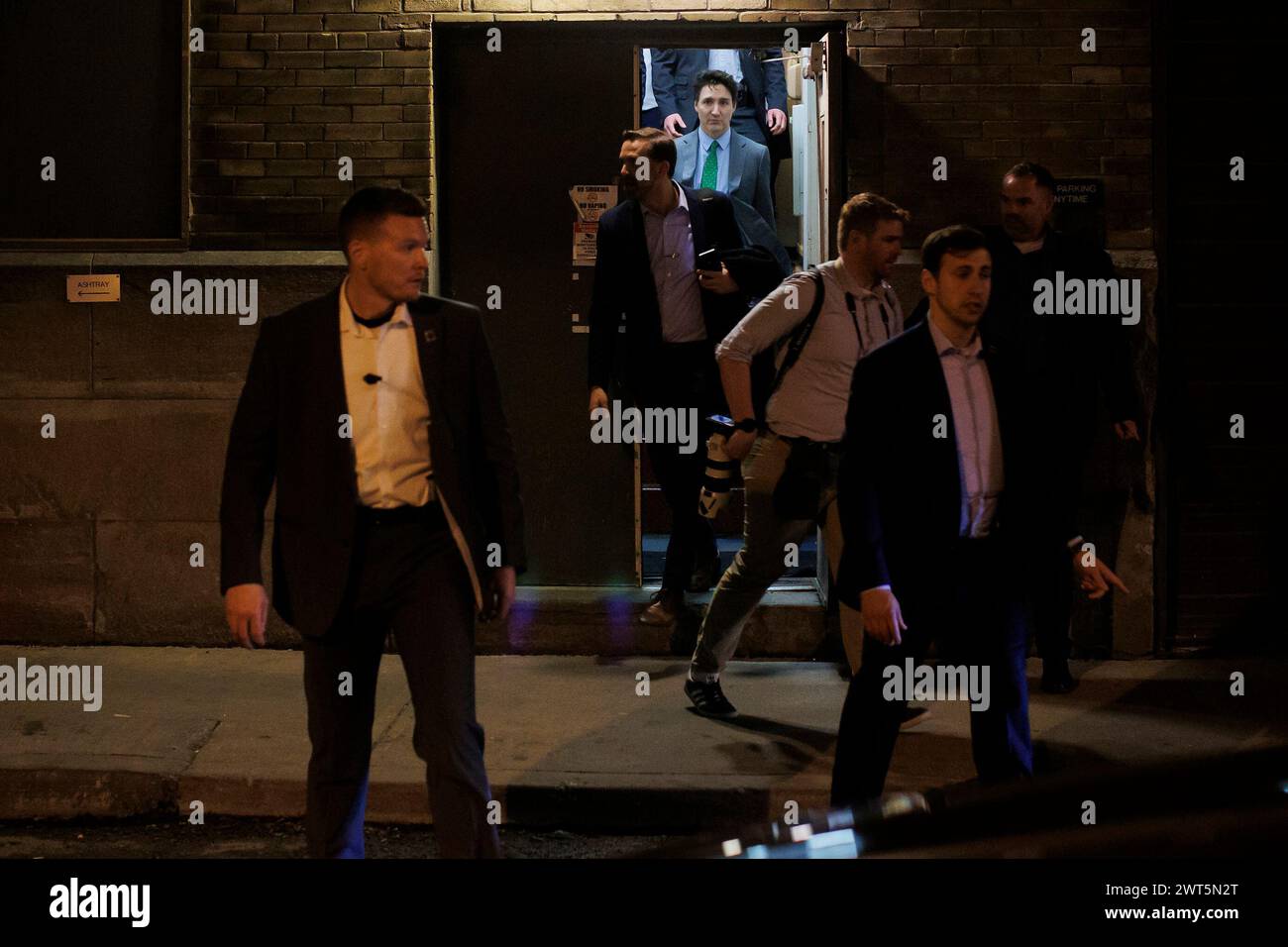 Prime Minister Justin Trudeau, top center, leaves an event in Toronto ...