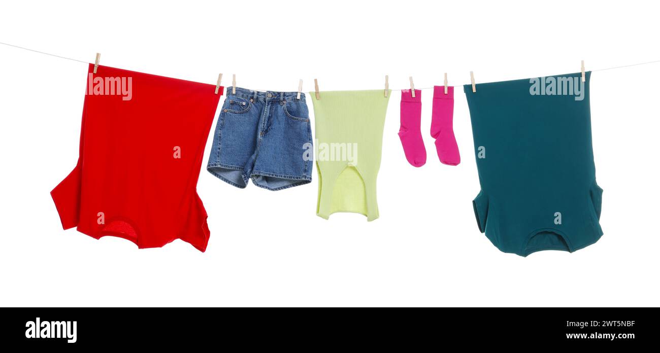 Different clothes drying on laundry line against white background Stock ...