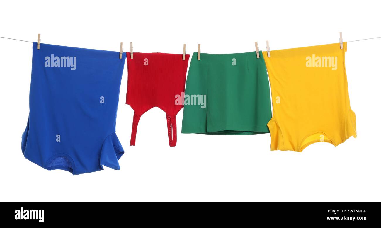 Different clothes drying on laundry line against white background Stock ...