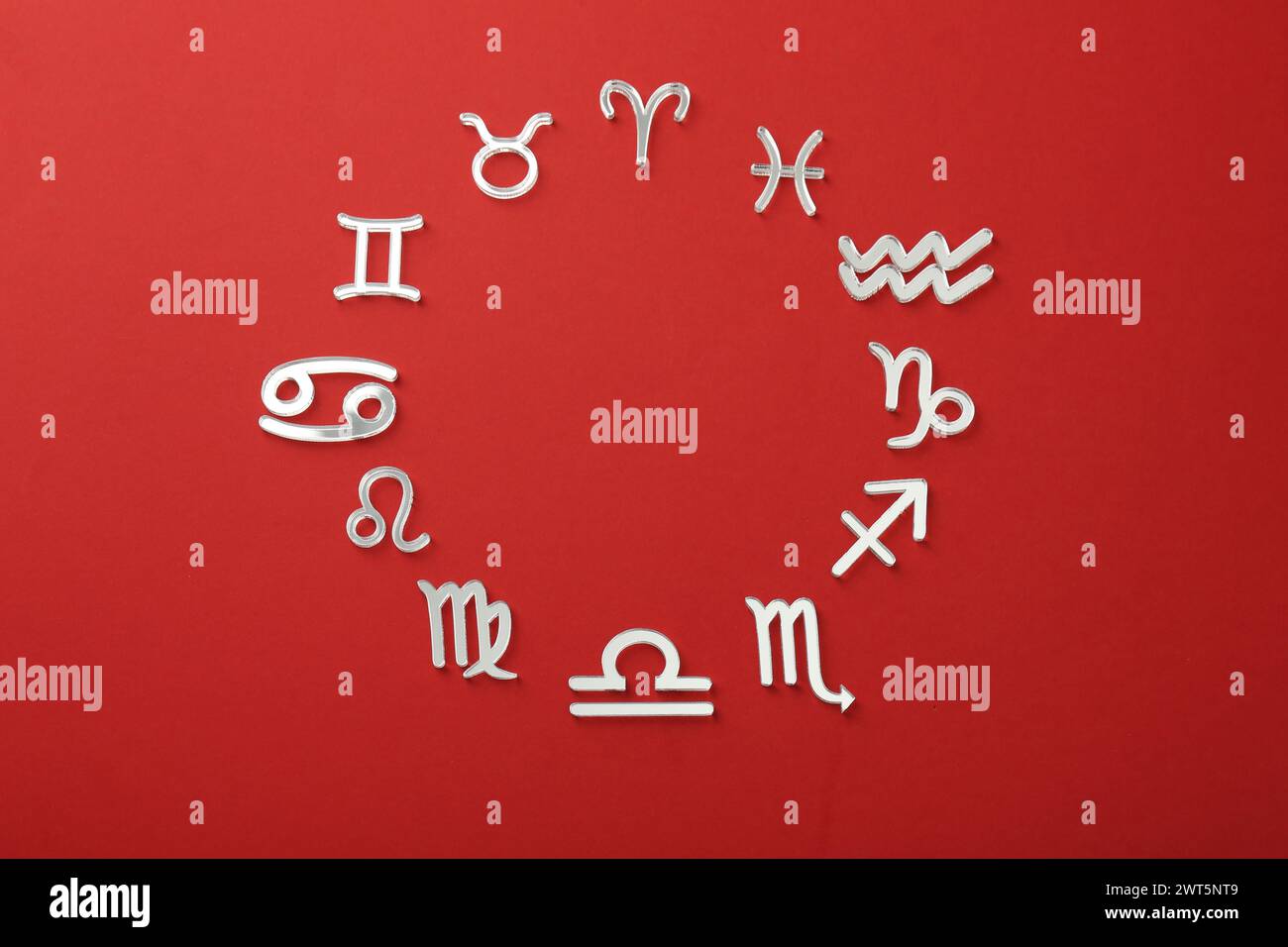 Zodiac signs on red background, flat lay. Space for text Stock Photo ...