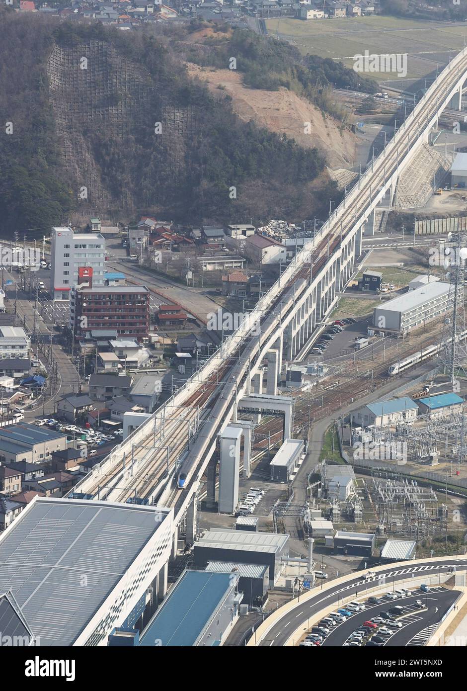 The Hokuriku Shinkansen arrives at Tsuruga Station in Tsuruga City ...
