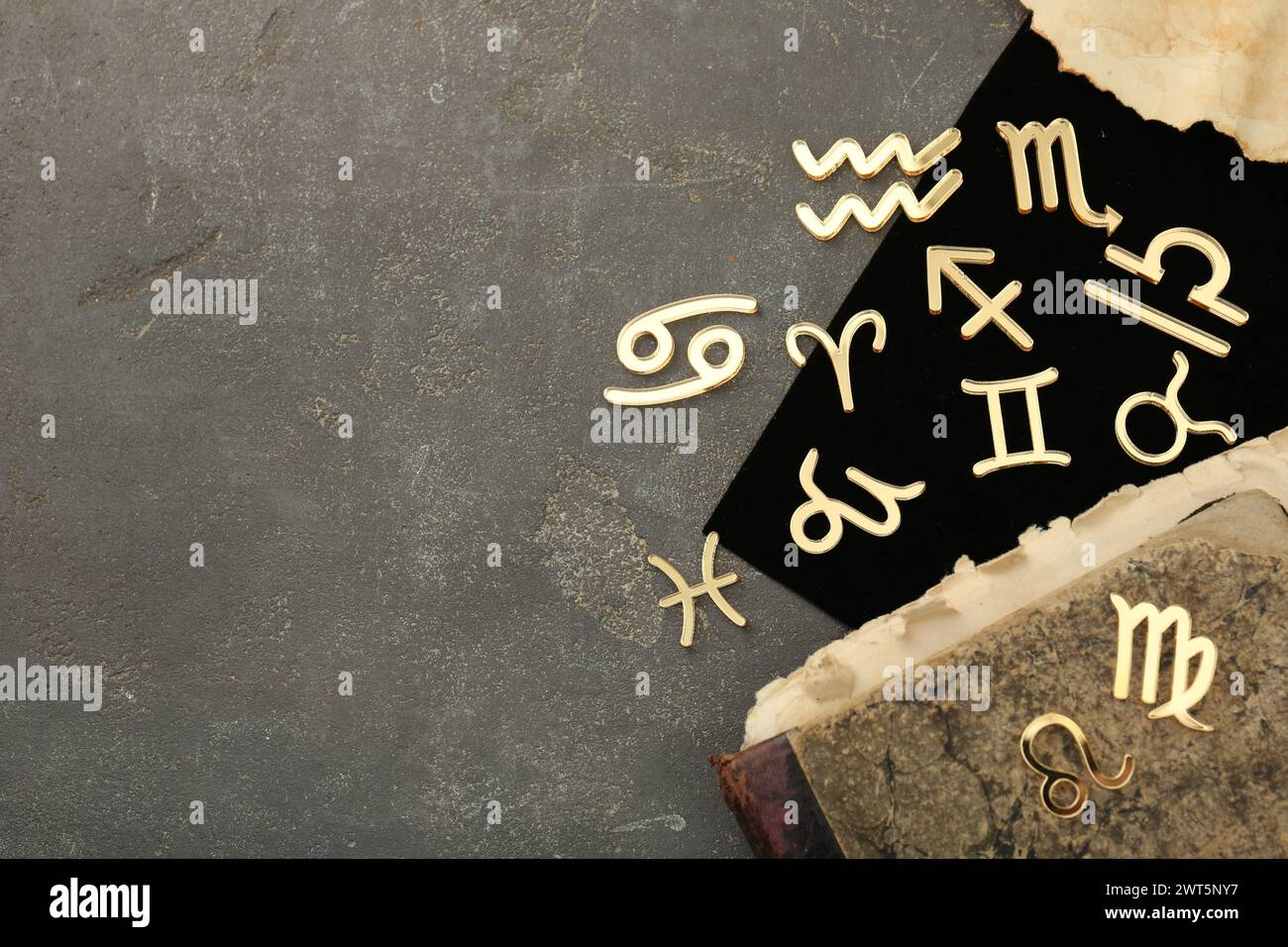 Zodiac signs, old book and letter on grey textured table, flat lay ...