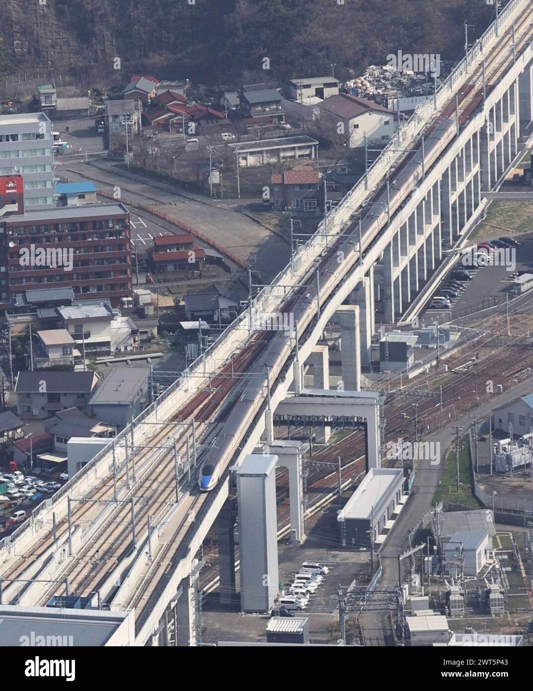 The Hokuriku Shinkansen arrives at Tsuruga Station in Tsuruga City ...