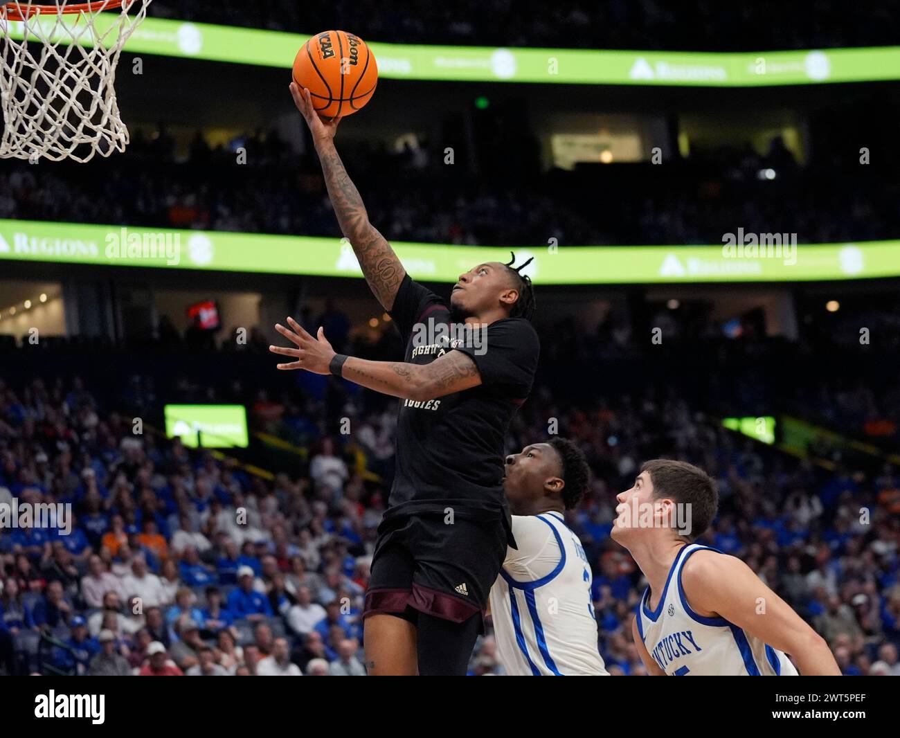 Texas A&M guard Wade Taylor IV (4) goes up for a shot as Kentucky's ...