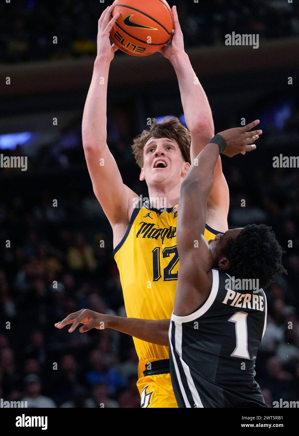 Marquette forward Ben Gold (12) shoots over Providence guard Jayden ...