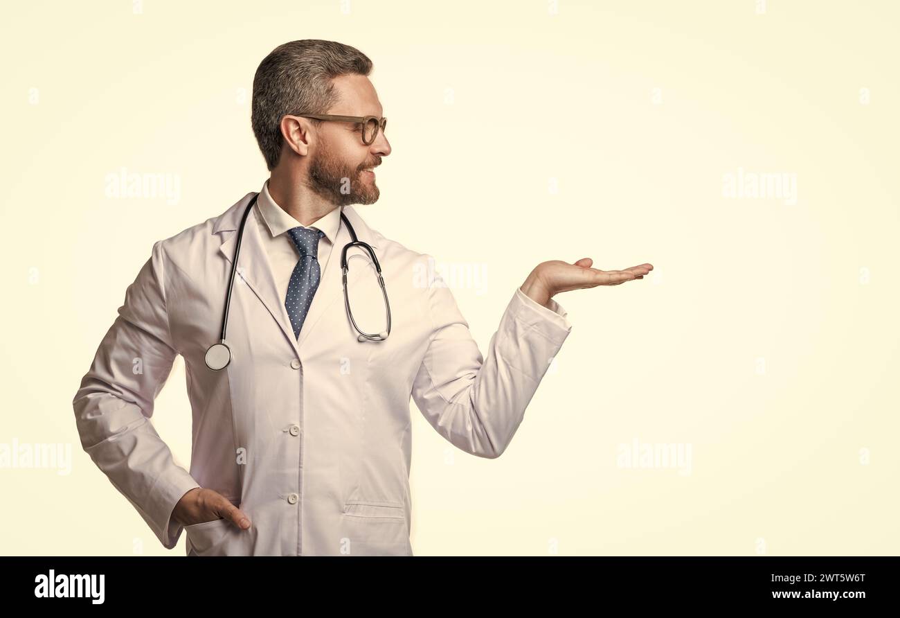 photo of medical man doctor, presenting. medical man isolated on white ...