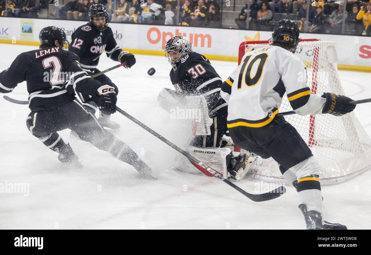 Omaha goaltender Simon Latkoczy (30) makes a save on a shot by Colorado ...