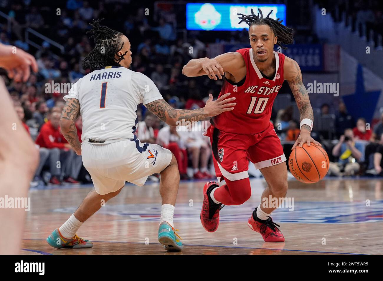 North Carolina State guard Breon Pass (10) goes up against Virginia ...