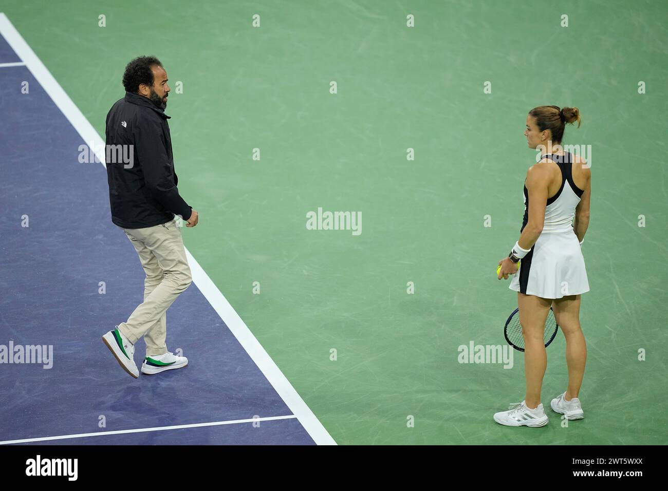 Maria Sakkari, of Greece, looks on as the game is suspended due to rain ...