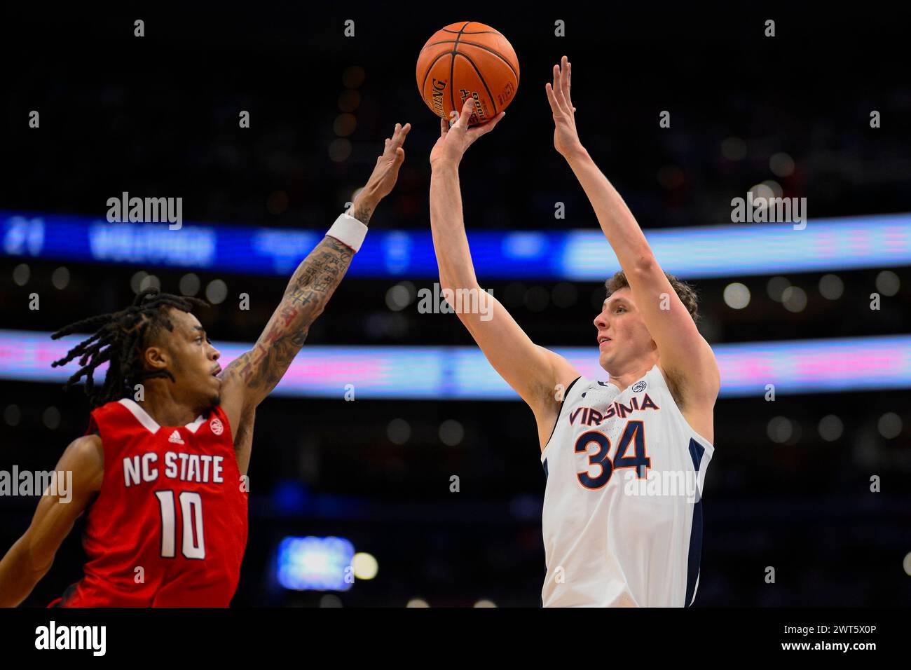 Virginia forward Jacob Groves (34) shoots against North Carolina State ...